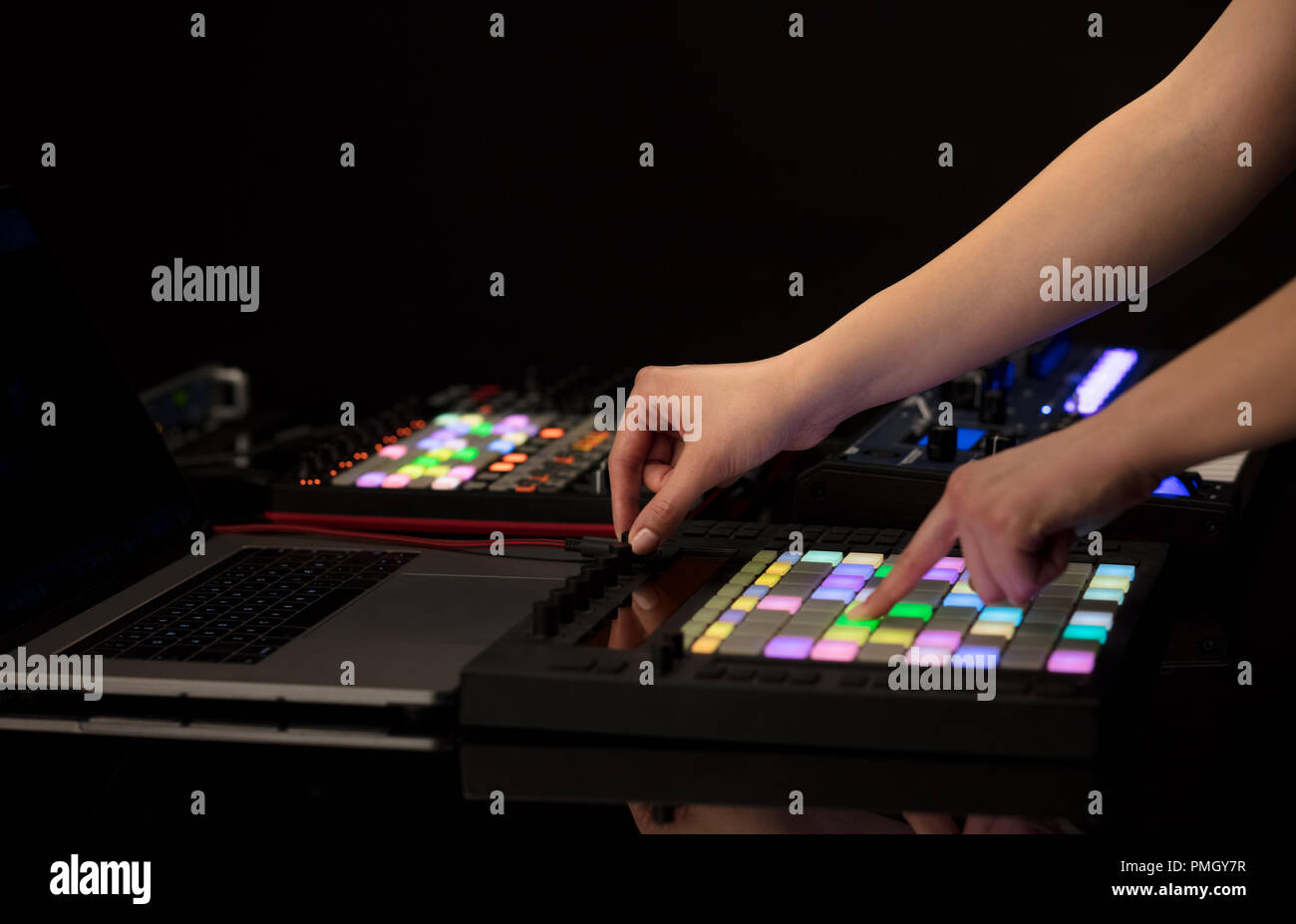 Dj hand remixing music on midi controller Stock Photo - Alamy