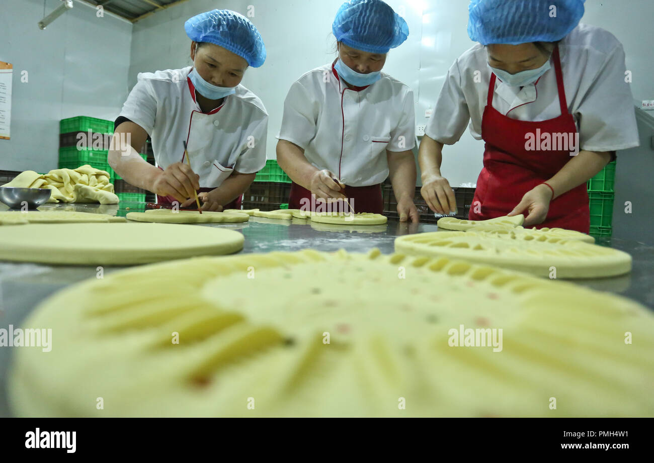 Zhangye, China's Gansu Province. 18th Sep, 2018. Staff make traditional ...
