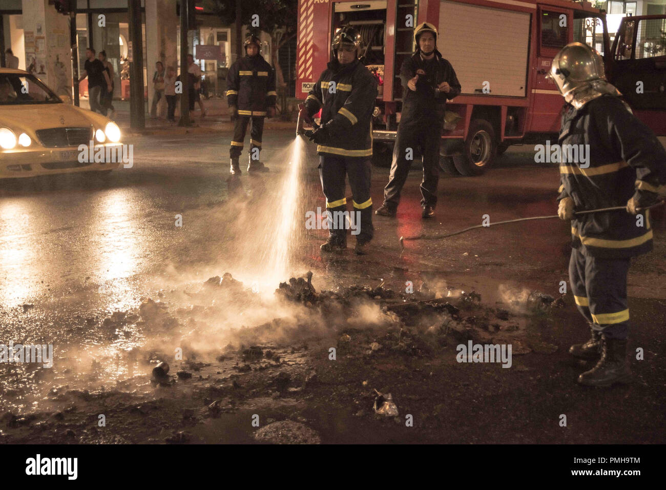 Athens, Greece. 18th Sep, 2018. Firefighters seen fading a fire when ...