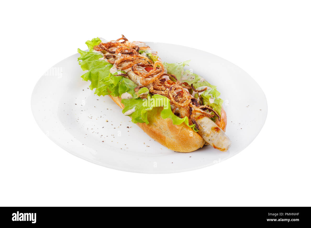 Hot dog with chicken, fish sausage, fried onions, lettuce, tomato and ...
