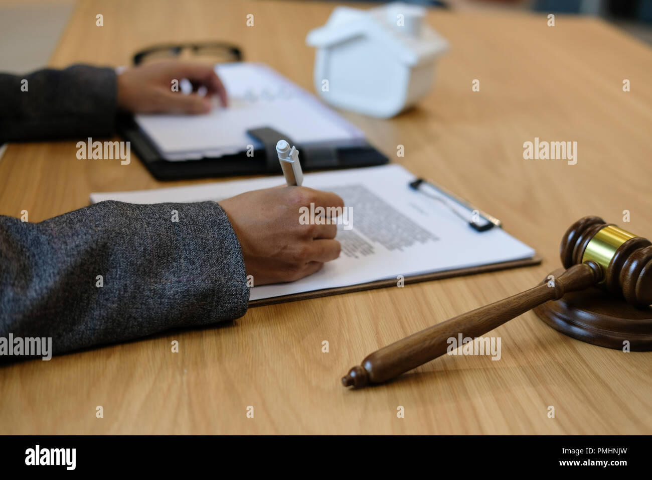 lawyer read contract. woman reviewing mortgage loan document with judge ...