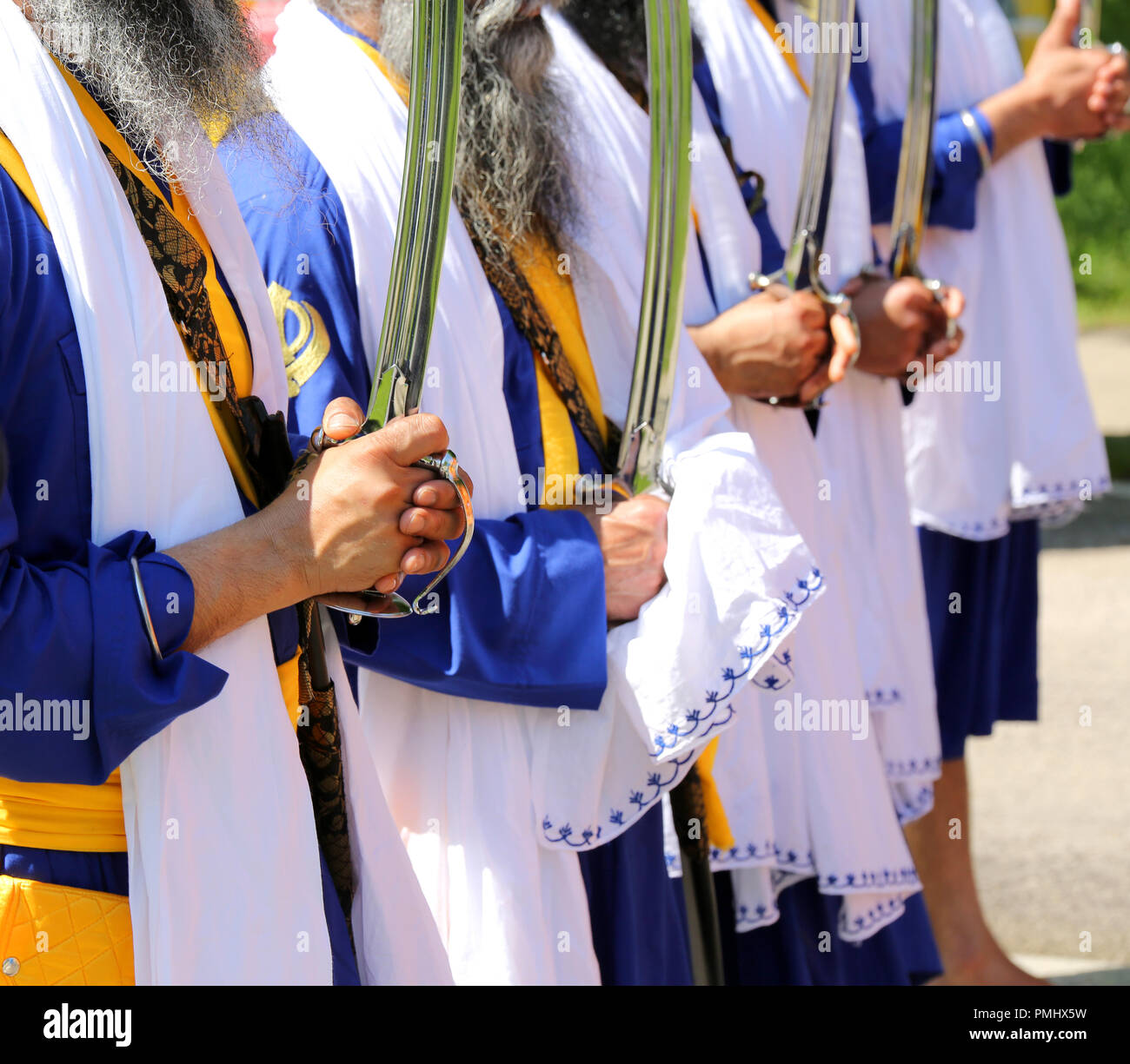 many sikh men with swords during a religious celebration Stock Photo ...