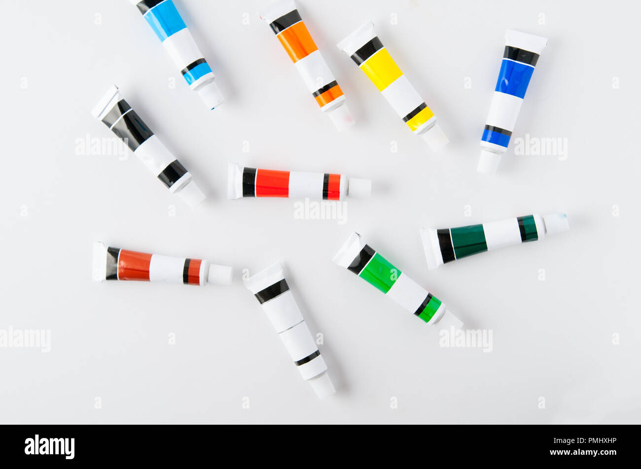 colorful paint tubes on a white background Stock Photo - Alamy