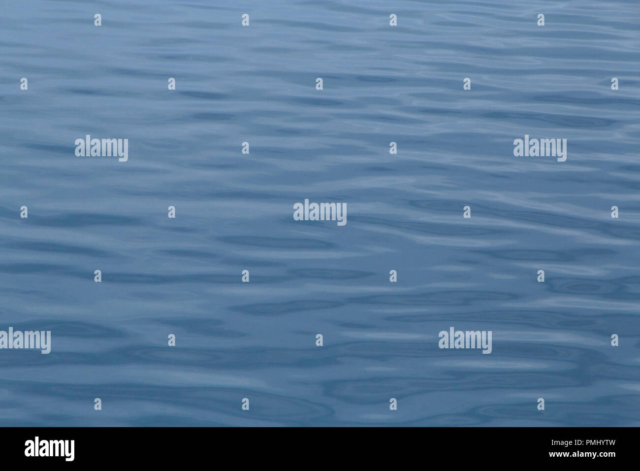 blue water surface with small waves background Stock Photo - Alamy