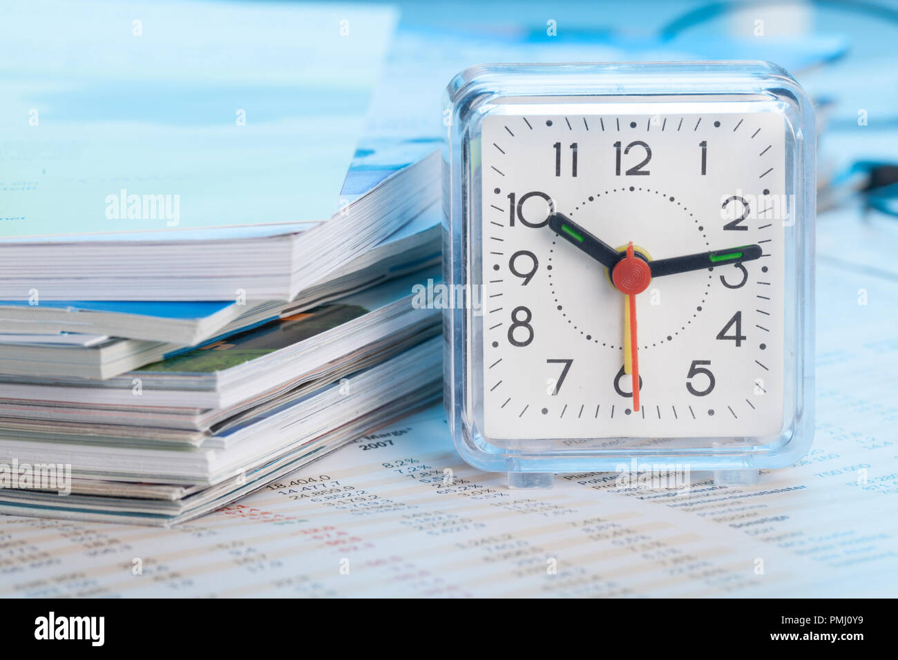 Alarm clock and business documents. Business and finance concept of ...