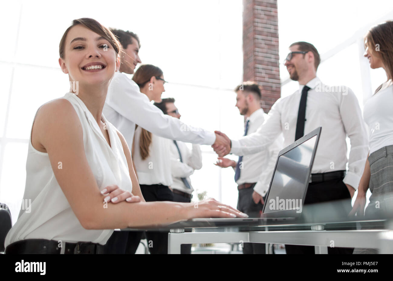 Manager shaking the hand of the employee in the office Stock Photo - Alamy