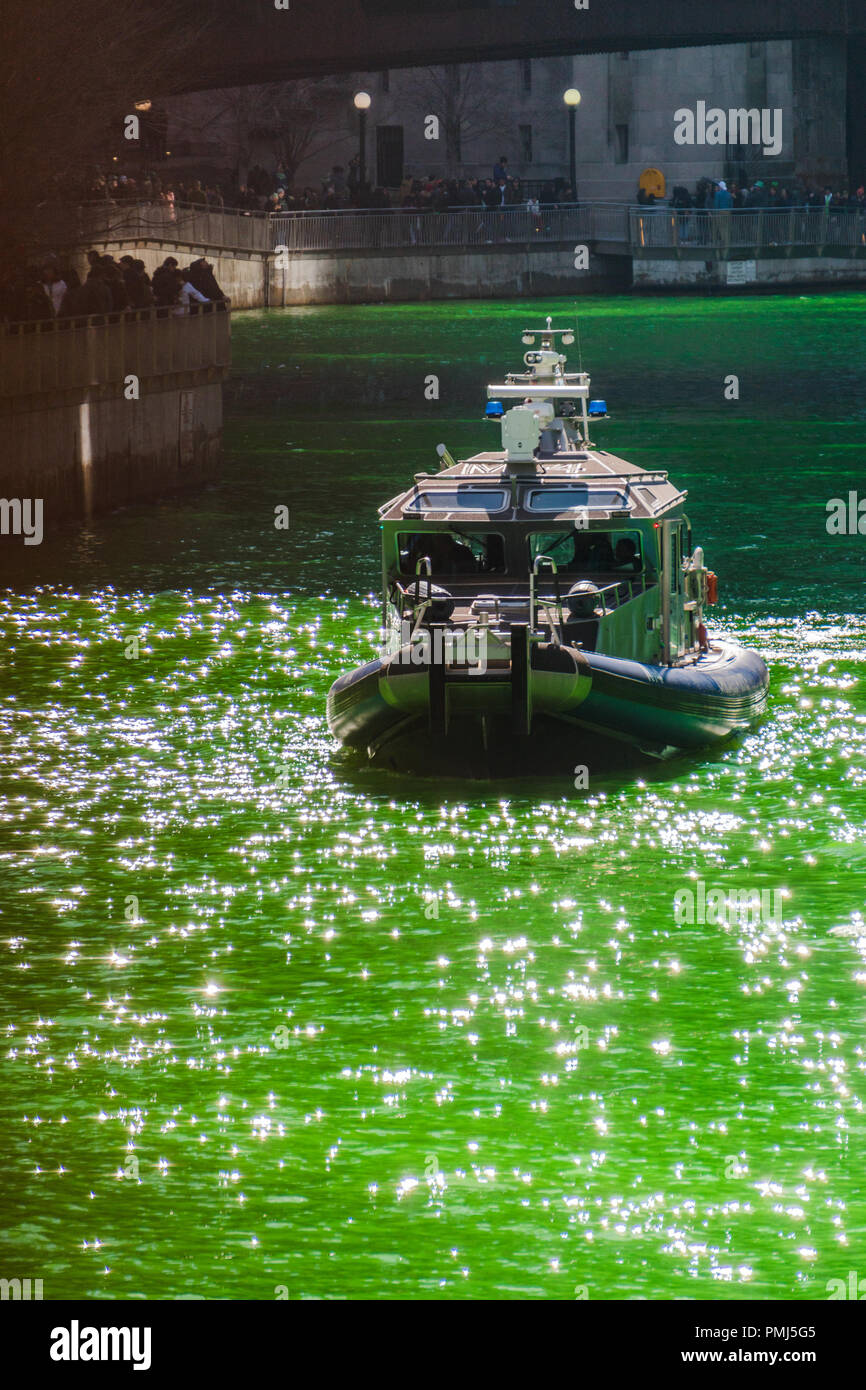 Boat sailing along Chicago river on St. Patrick's Day, Chicago ...