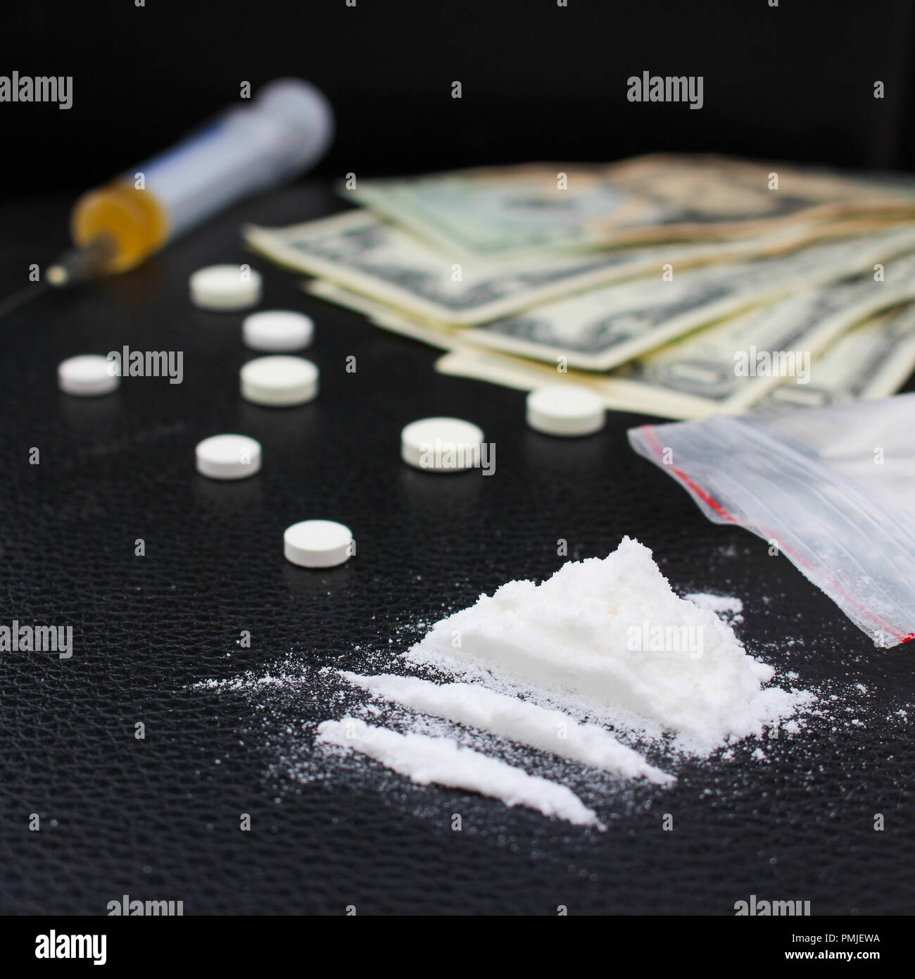 Drug addiction on black background Stock Photo - Alamy
