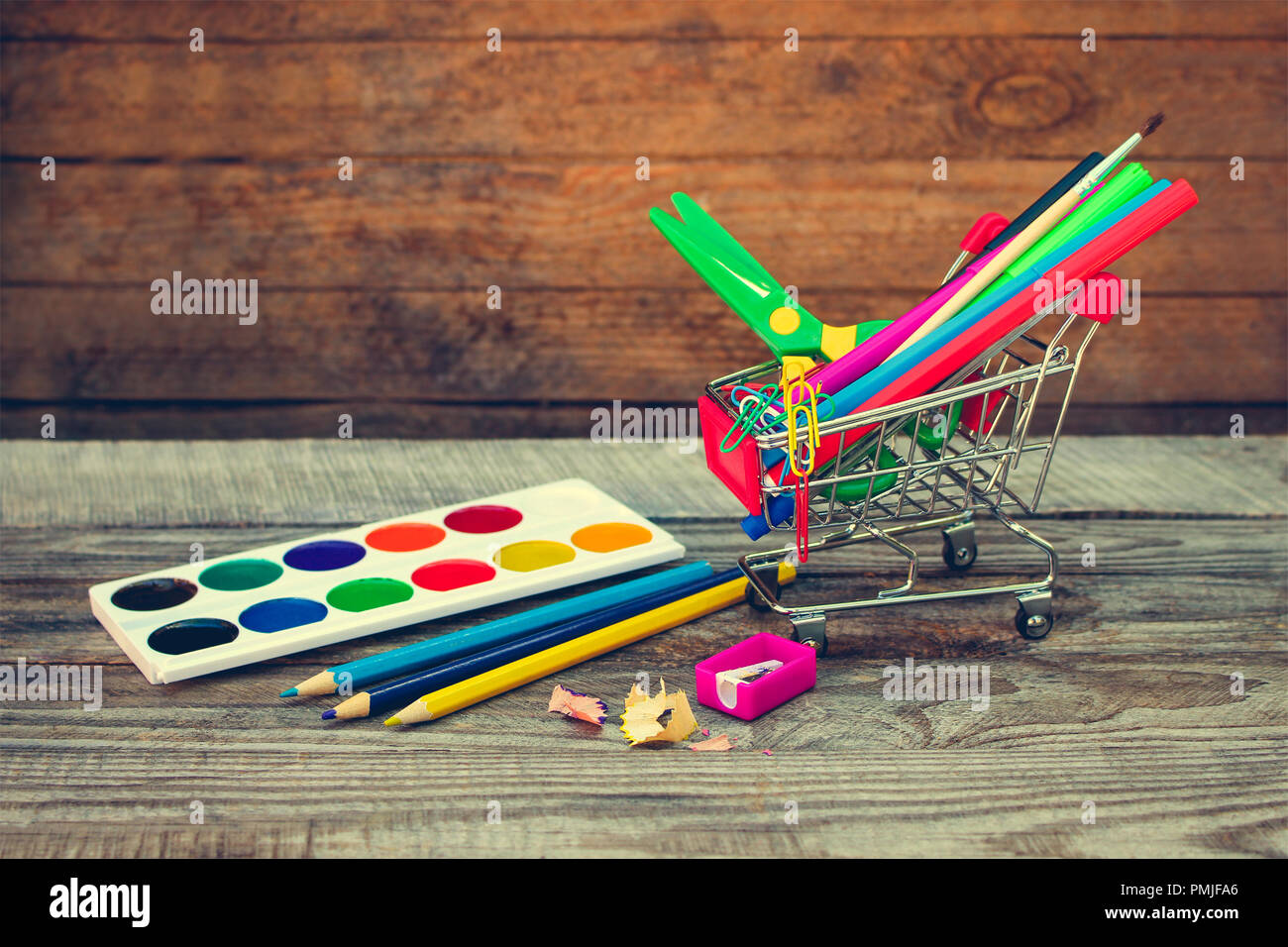 Shopping cart with stationery objects. Office and school supplies Stock ...