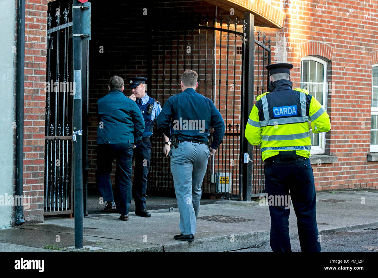 Garda Detectives outside an apartment block on Linen Hall Street ...