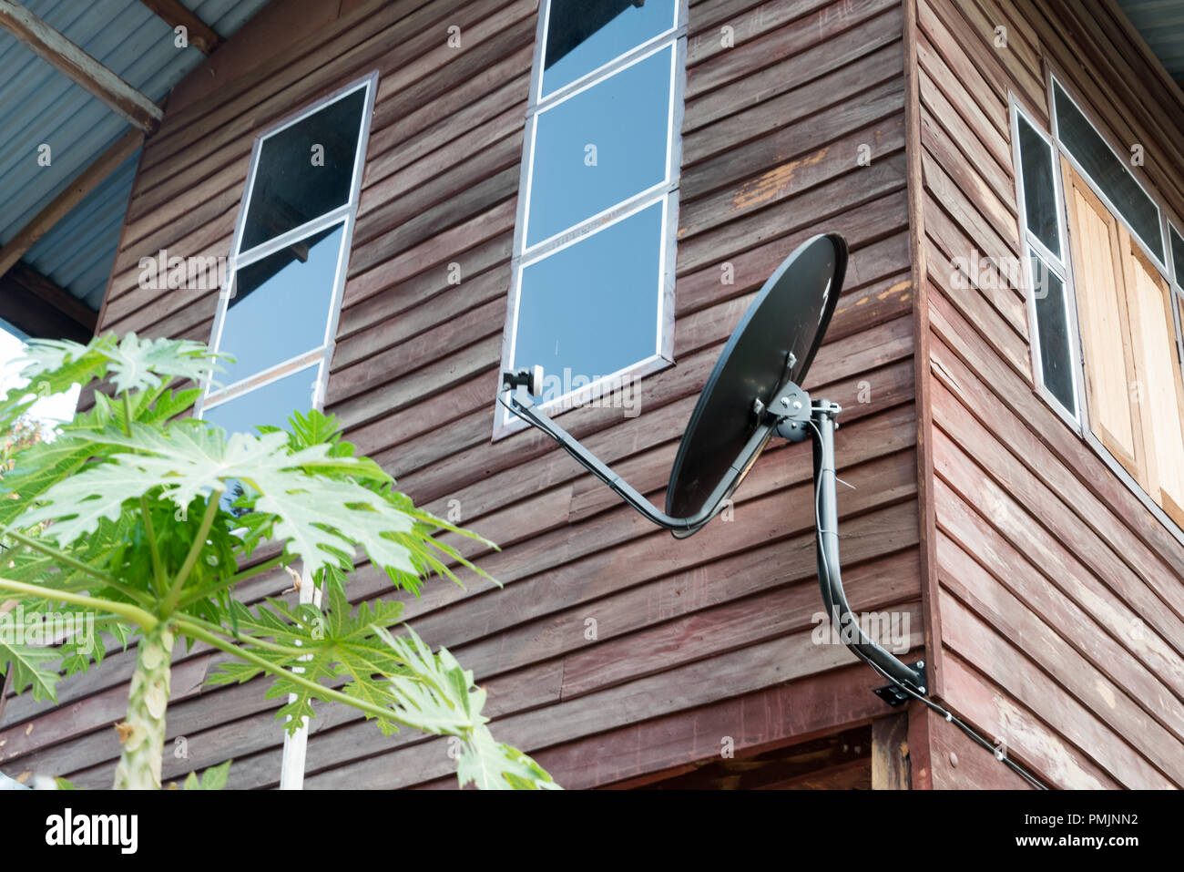 old wooden house rural style of Thailand with TV satellite Stock Photo ...