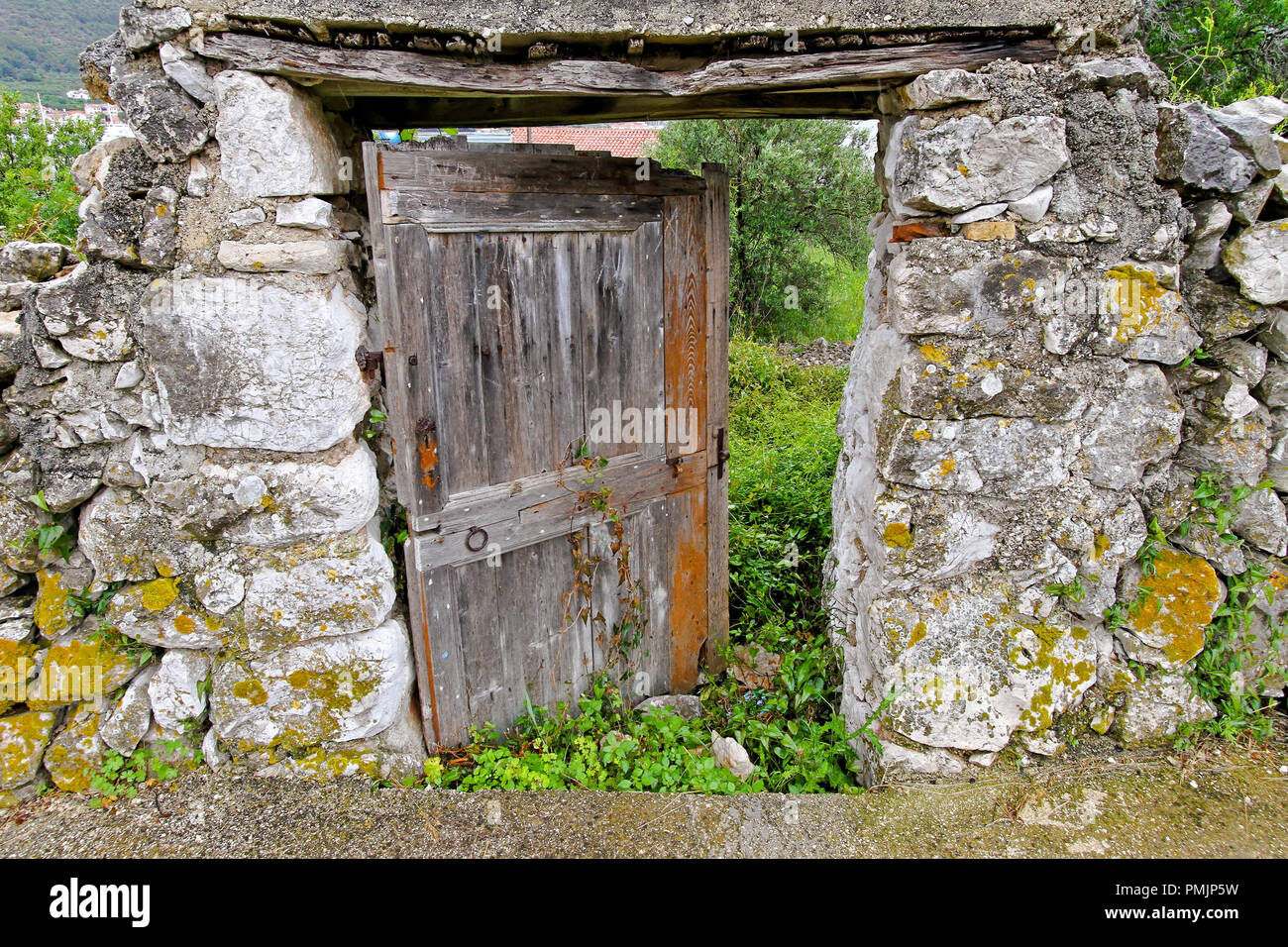Abandoned property door in very bad condition exterior Stock Photo - Alamy