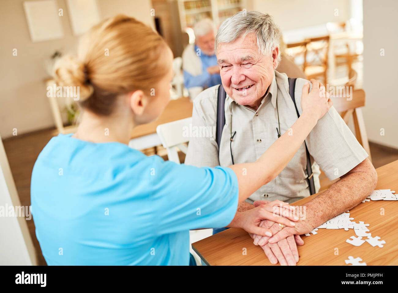 Old man hand on shoulder hi-res stock photography and images - Alamy