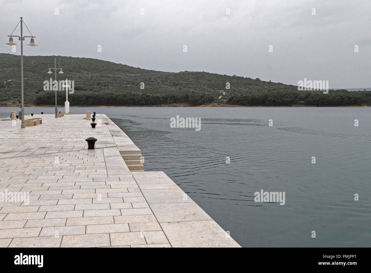 Rainy Day at White Marble Stone Dock in Island Cres Stock Photo - Alamy