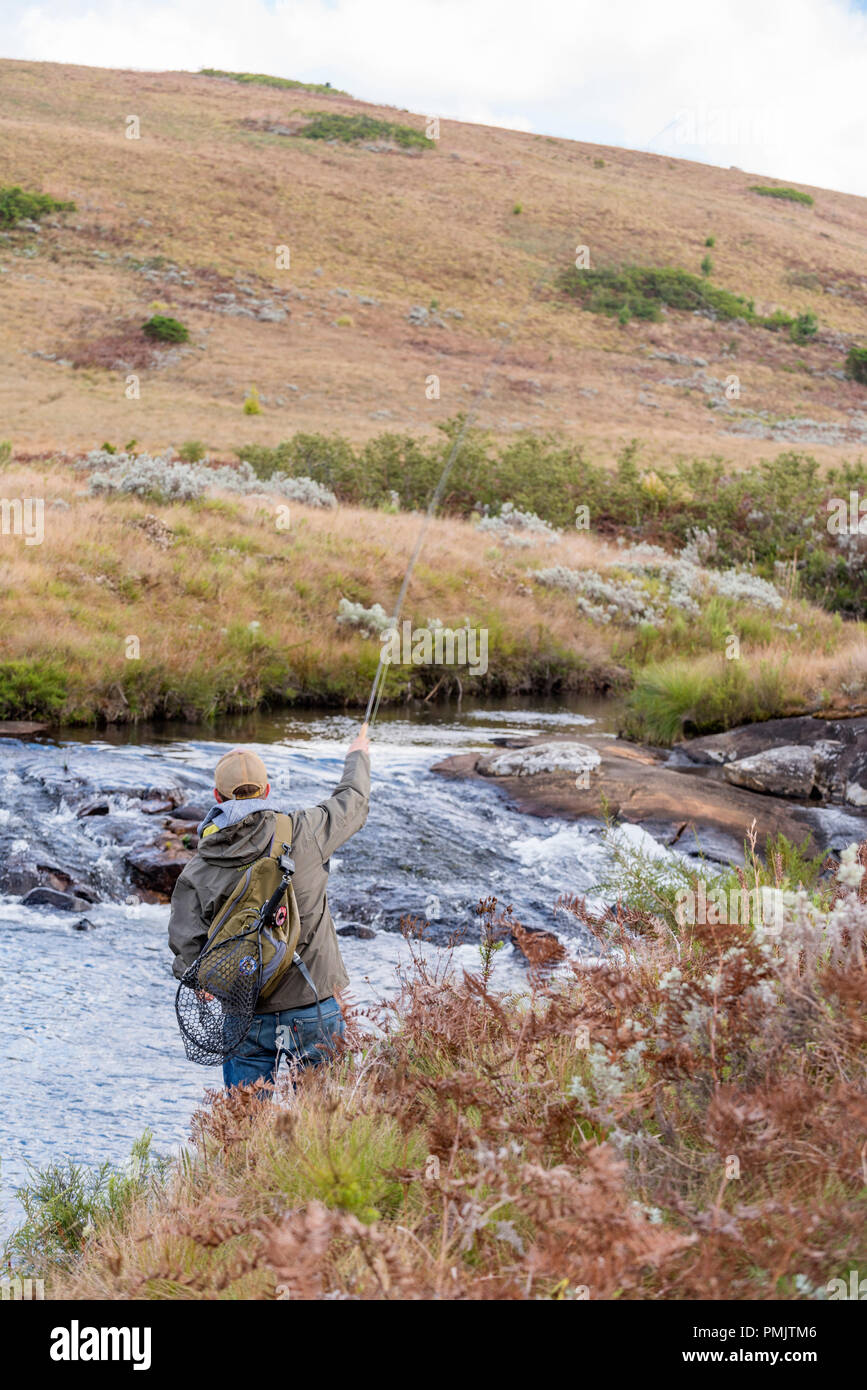 A fly fisherman plies the wild rivers of Nyanga National Park in ...
