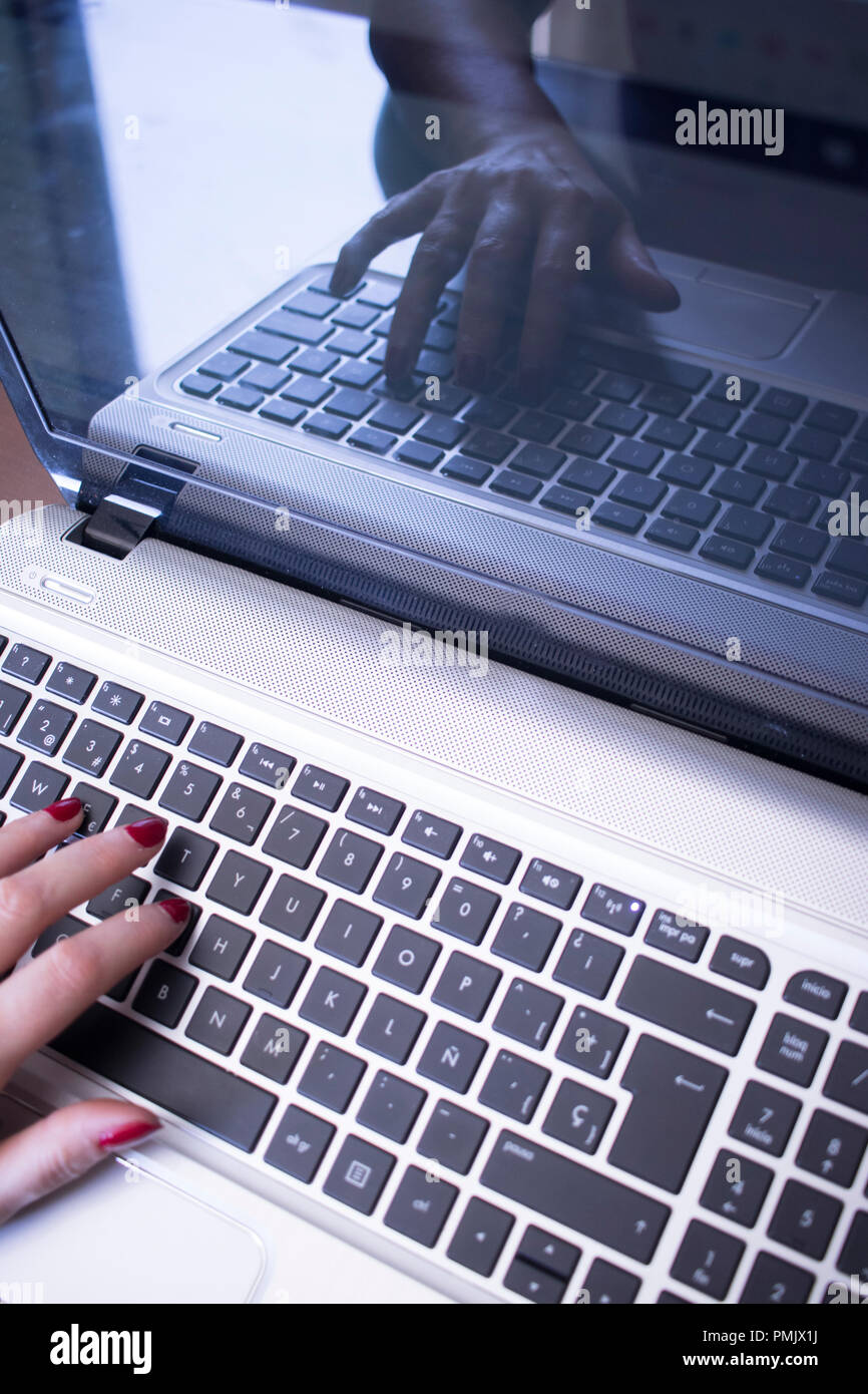 Secretary typist typing on laptop pc computer keyboard keys with hands ...