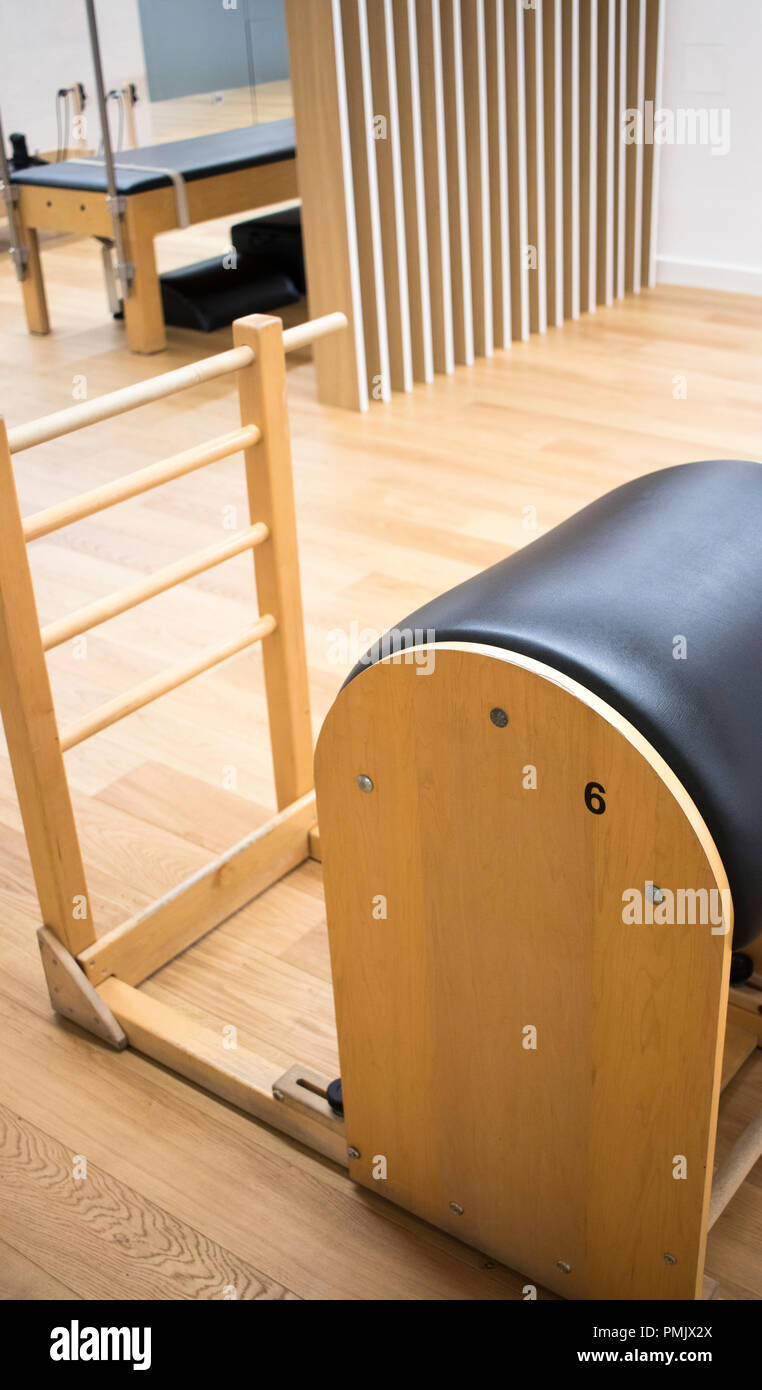 Pilates machine fitness studio gym room with training barrel Stock ...