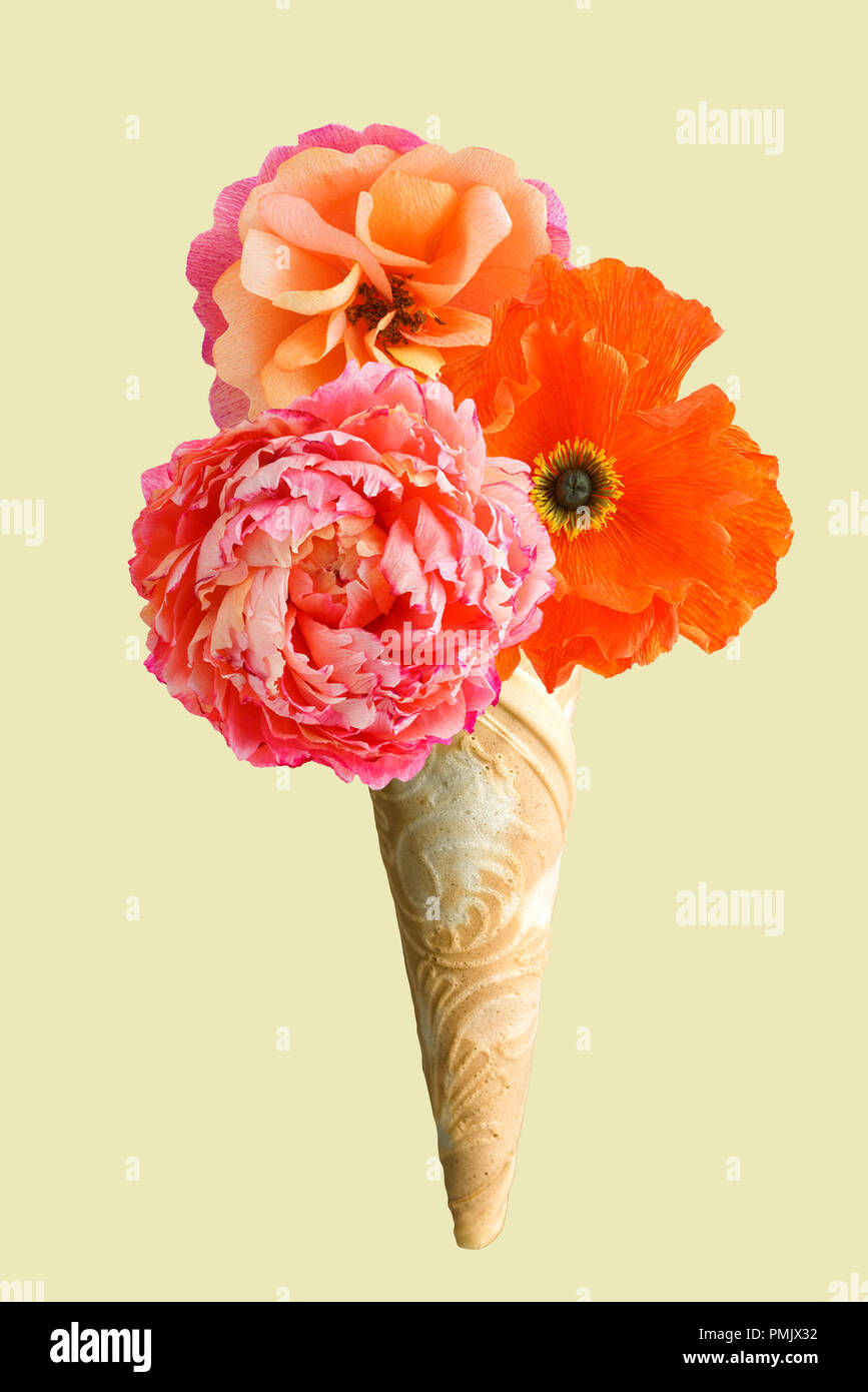 Ice cream cone filled with handmade crepe paper flowers isolated on ...