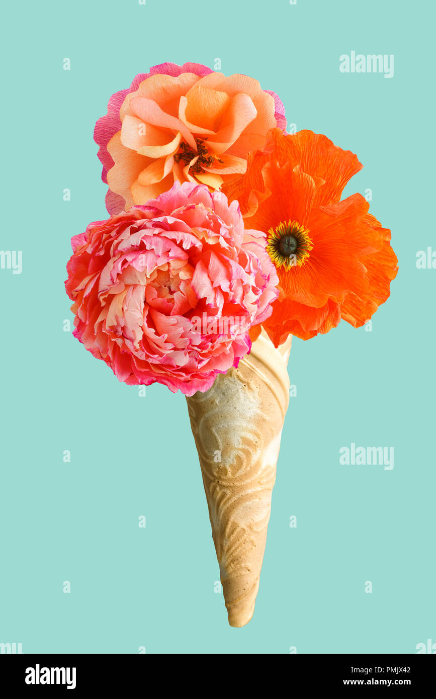 Ice cream cone filled with handmade crepe paper flowers isolated on ...