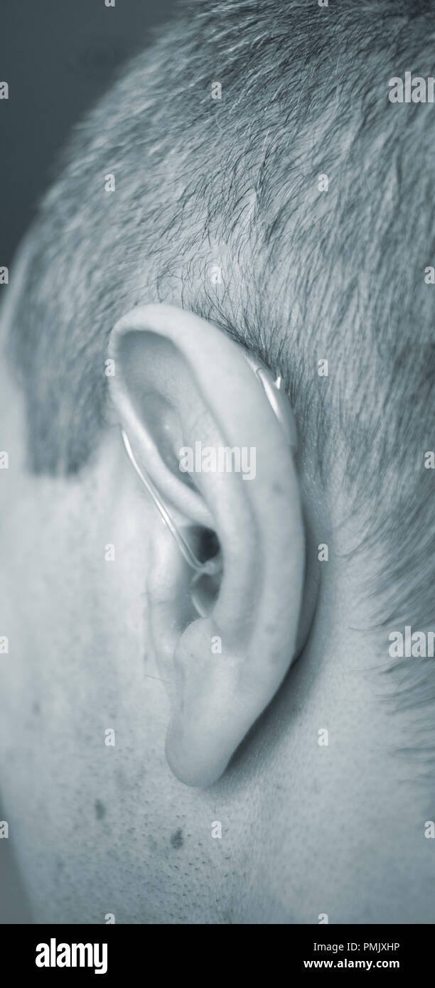 Modern compact in the ear digital audiophone hearing aid in the ear of ...