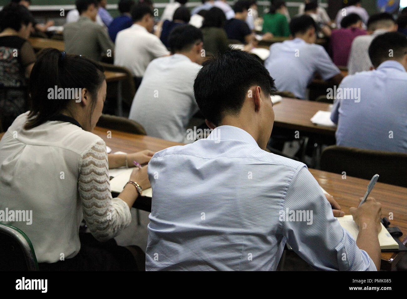 Students working in the Grand Peoples Study House at Pyongyang which is ...