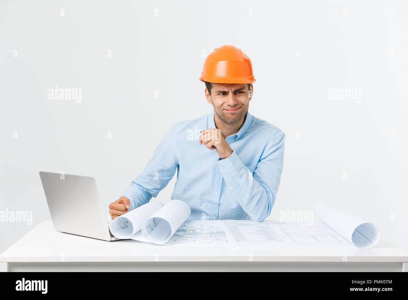Serious man businessman or engineer sitting in construction site ...