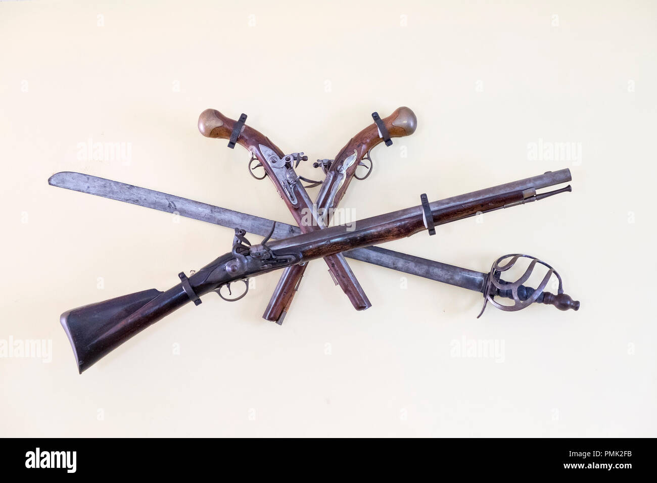 Antique military weapons including a sword, rifle and two pistols Stock ...