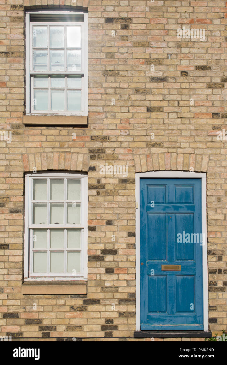 Blue pastel vintage front door on a restored brick wall of a Georgian ...