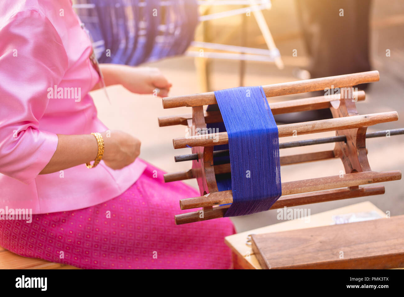 asian master hand craft making silk fabric textile with yarn winder ...