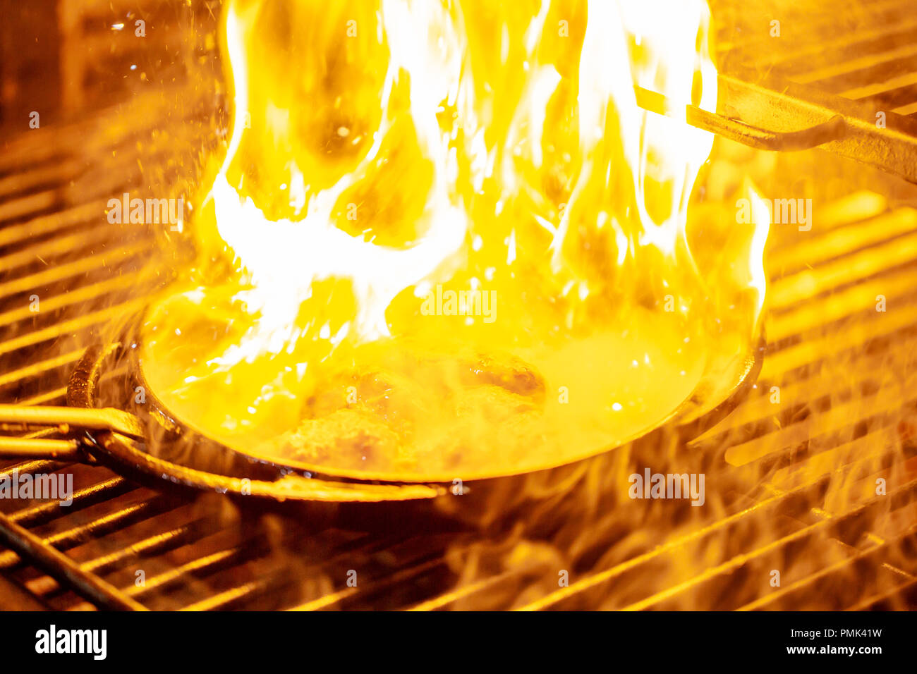 Grilled beef and pork meat steak in frying pan. cooking on an open fire ...