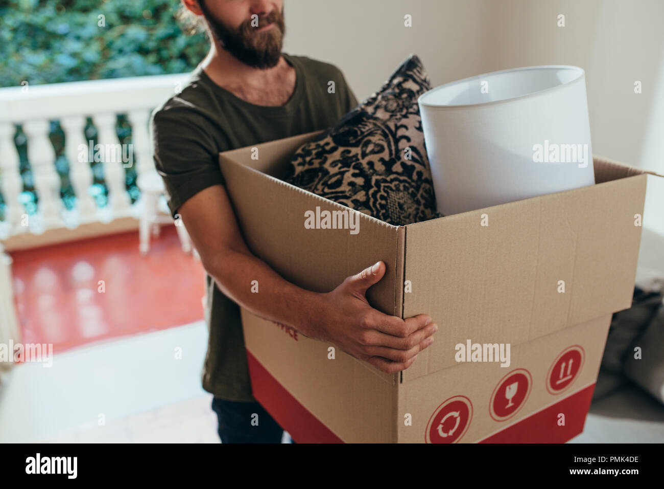 Man walking with boxes hi-res stock photography and images - Alamy