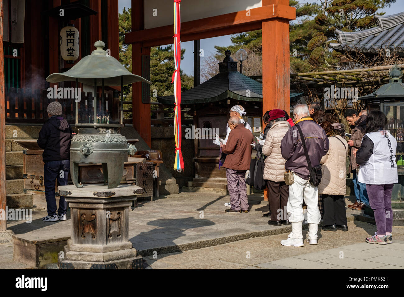 NARA, JAPAN - JAN 30, 2018: Japanese people praying on temple of Nara ...