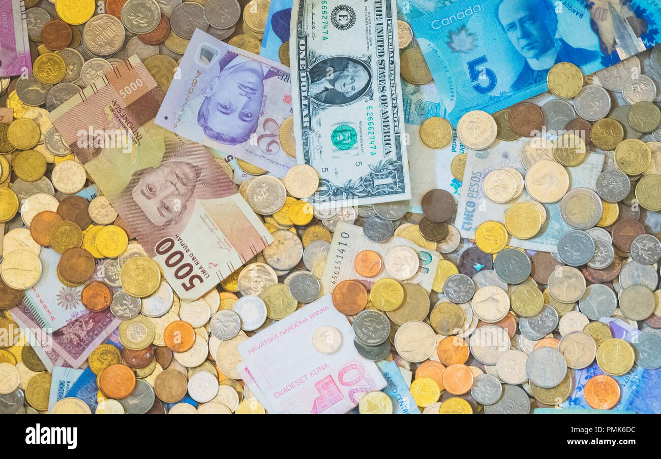 Lots of different money. Banknotes and coins Stock Photo - Alamy
