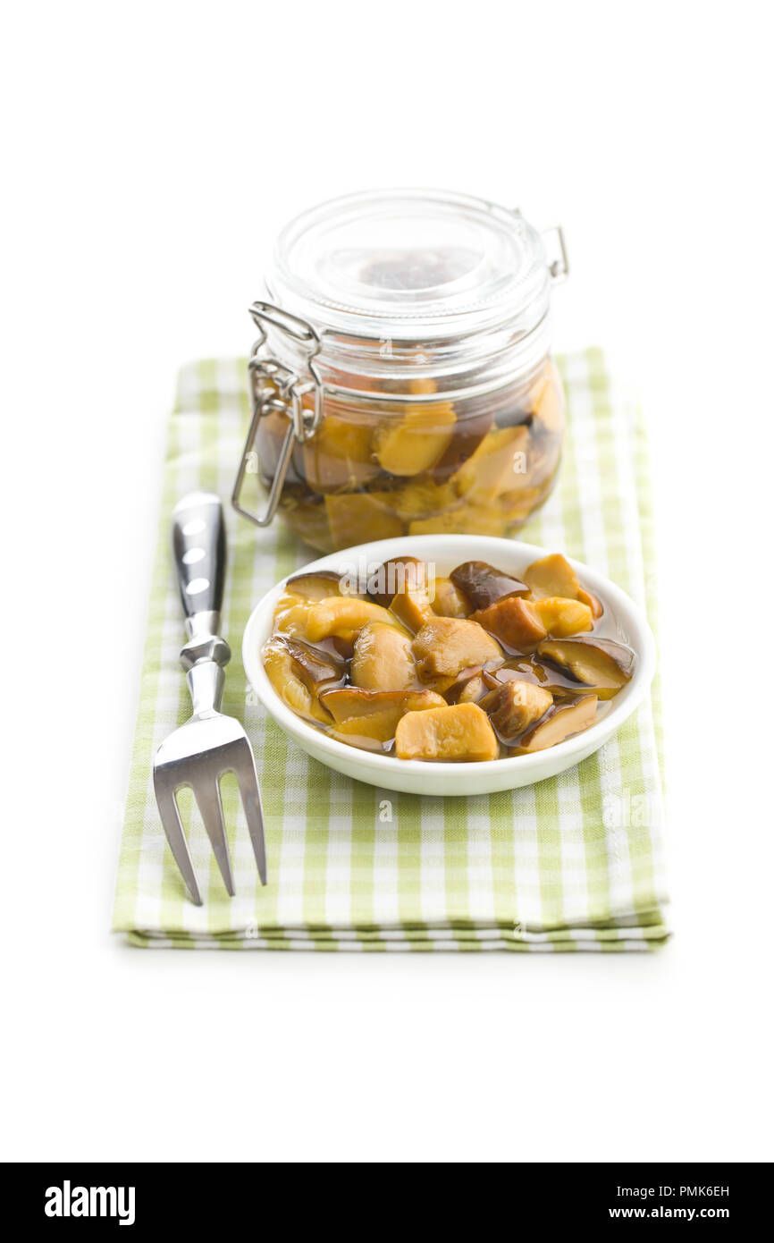 Pickled mushrooms. Marinated boletus on napkin isolated on white ...
