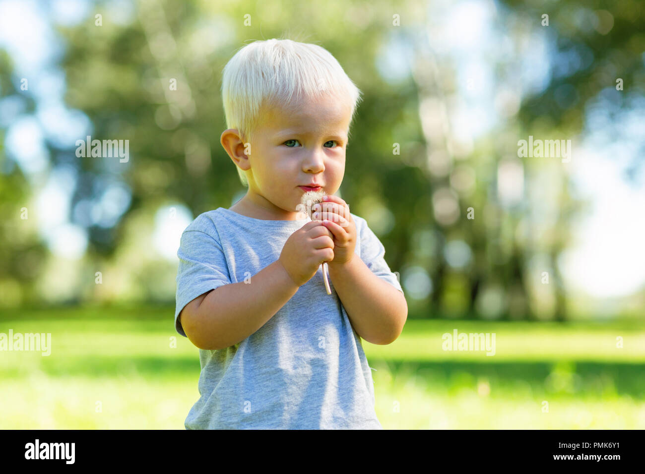 Shy cute child looking at you attentively Stock Photo - Alamy