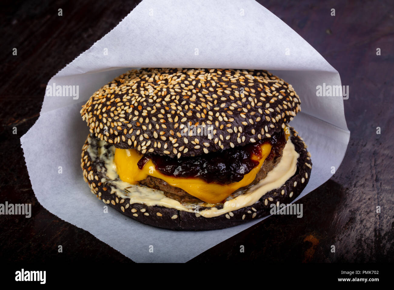 Black burger with cutlet and cheese Stock Photo - Alamy