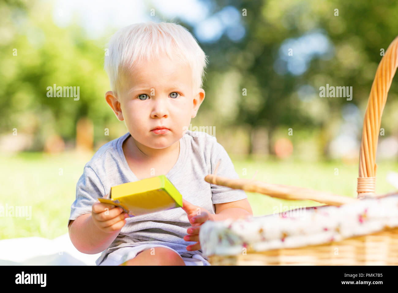 Nice little child looking at you attentively Stock Photo - Alamy