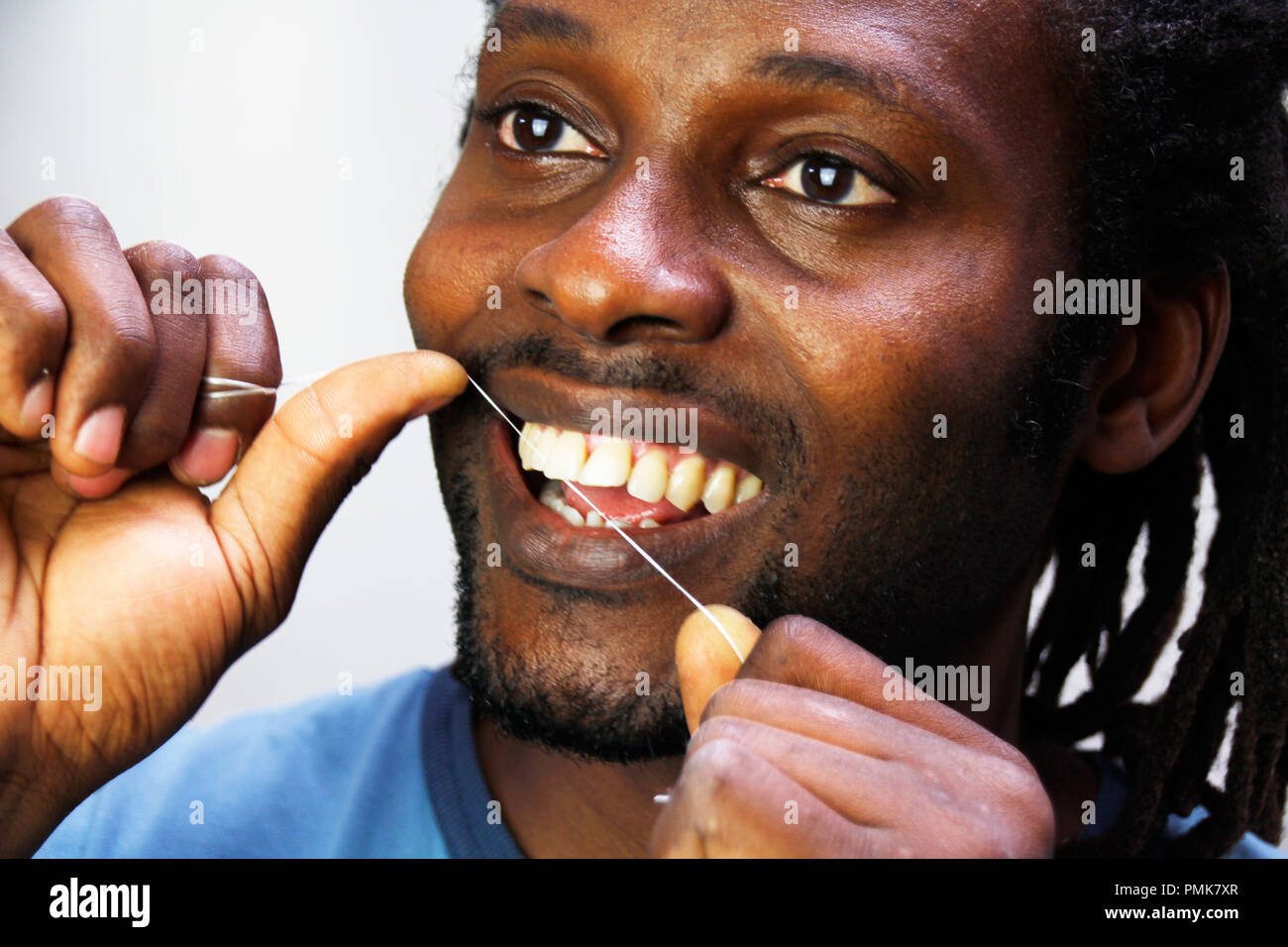 Man Flossing his teeth Stock Photo - Alamy