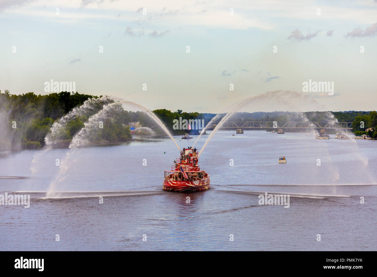 The New York City Fire Department's fireboat John. J. Harvey leads ...