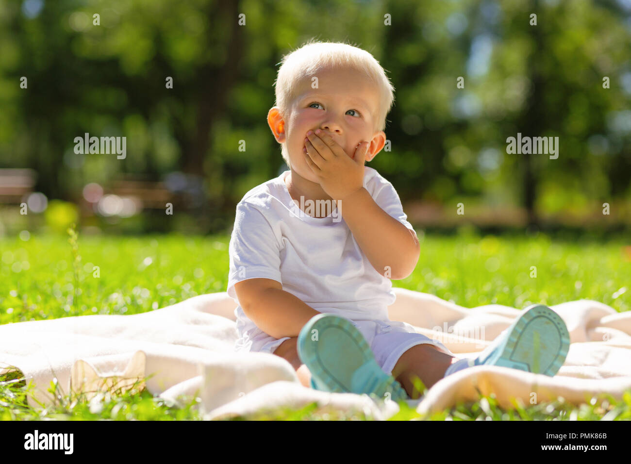 Sweet little kid looking at the sky Stock Photo - Alamy