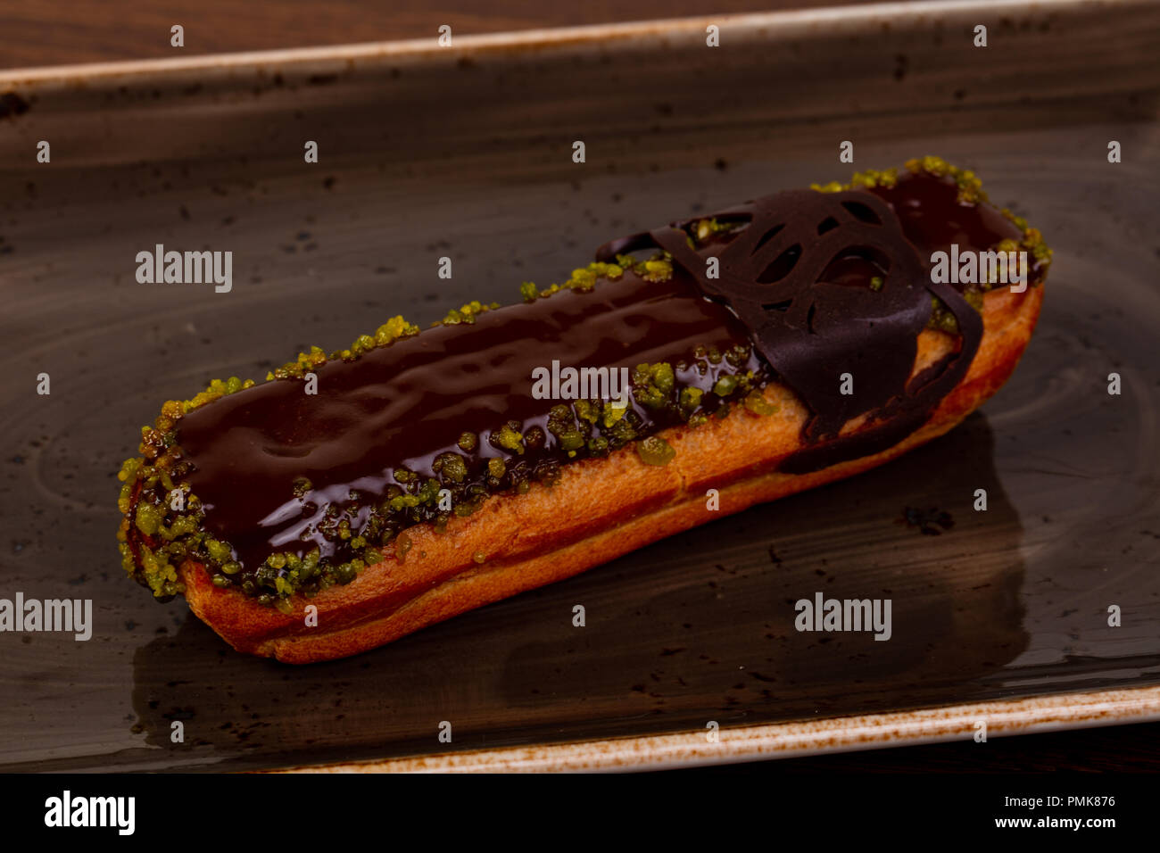 Tasty sweet Eclair with cream Stock Photo - Alamy