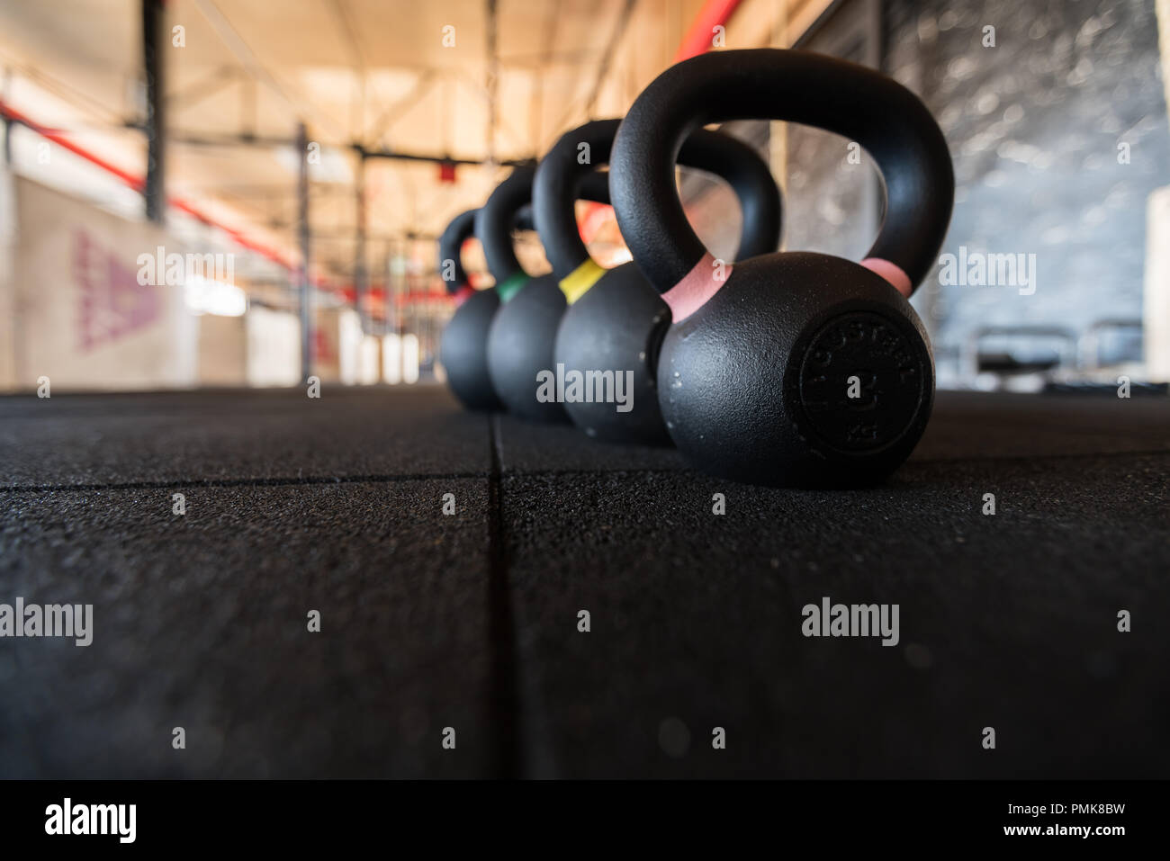 Row of kettlebell or girya weights in a gym weight in a fitness and ...