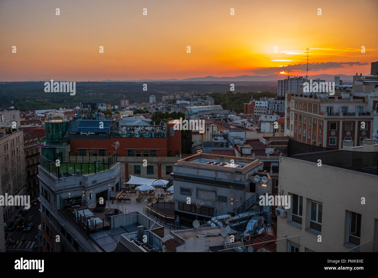 Madrid, Spain, June 21, 2018: The sun sets over the Madrid horizon ...