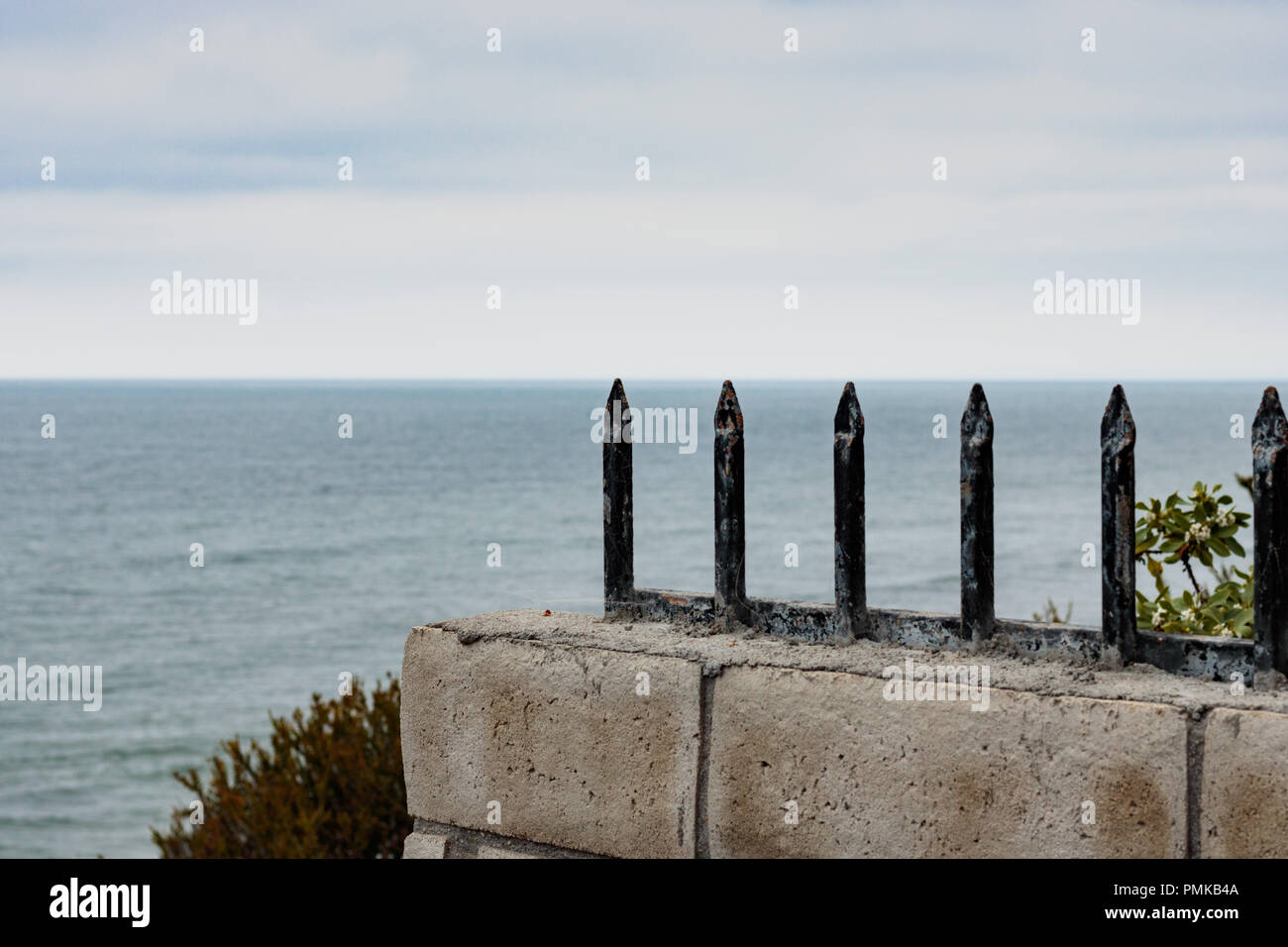Gothic spikes seated in an old block wall closeup pointing perfectly to ...