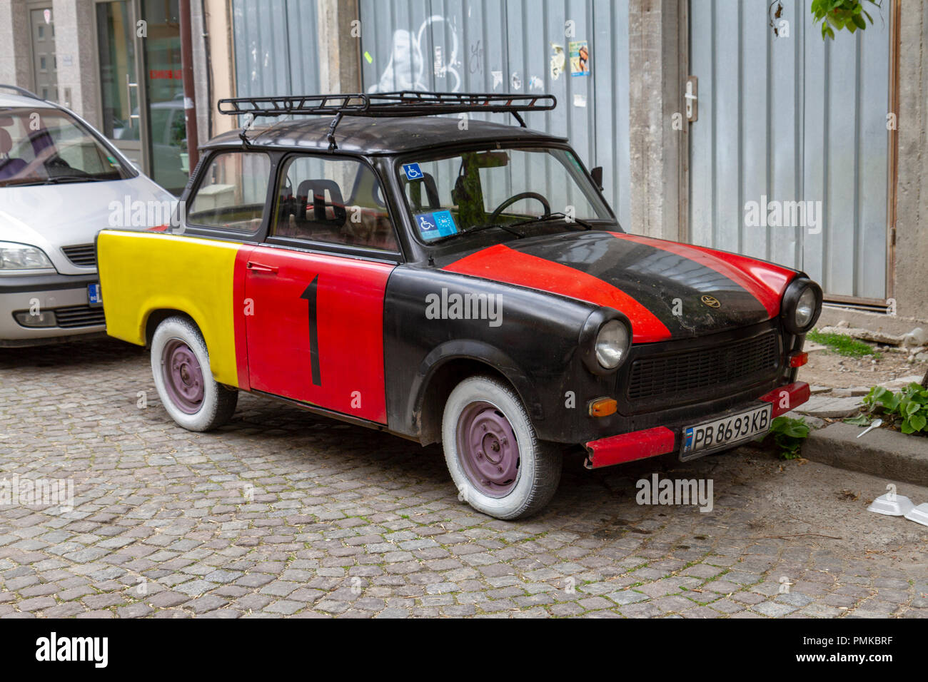 A brightly coloured Trabant car parked in the Old Town of Plovdiv ...