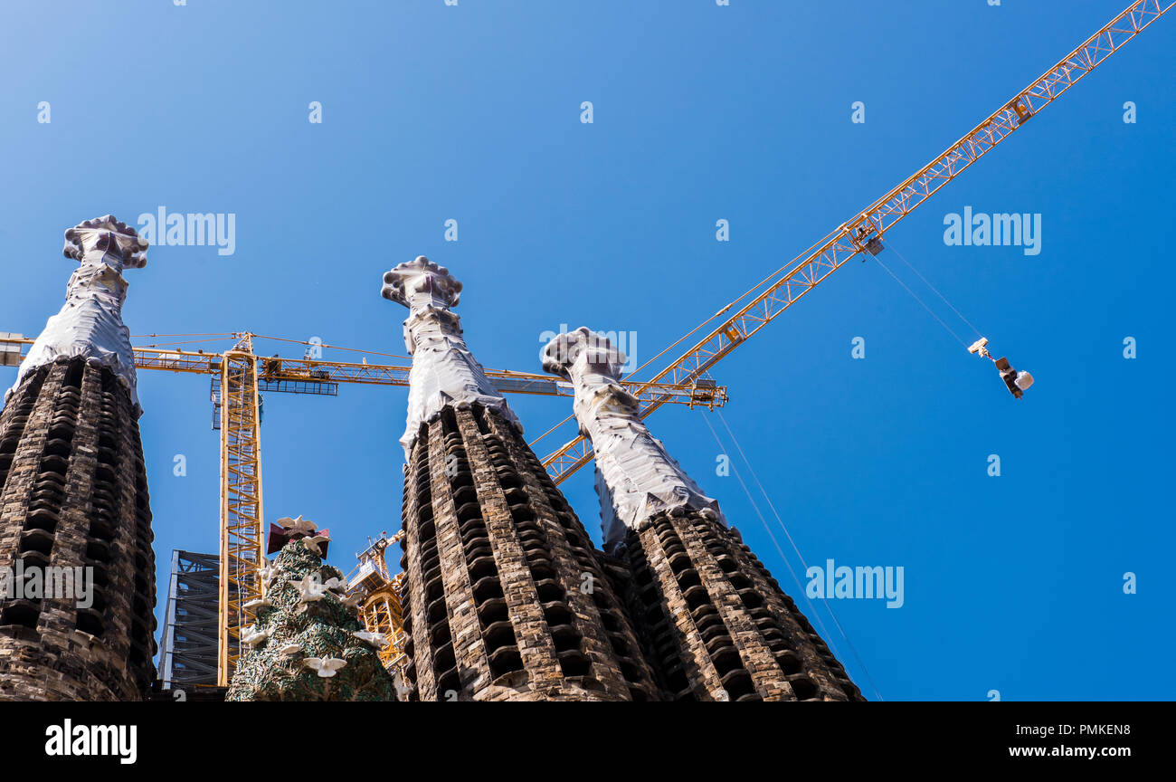The spires of the Sagrada Familia, with construction cranes in view ...