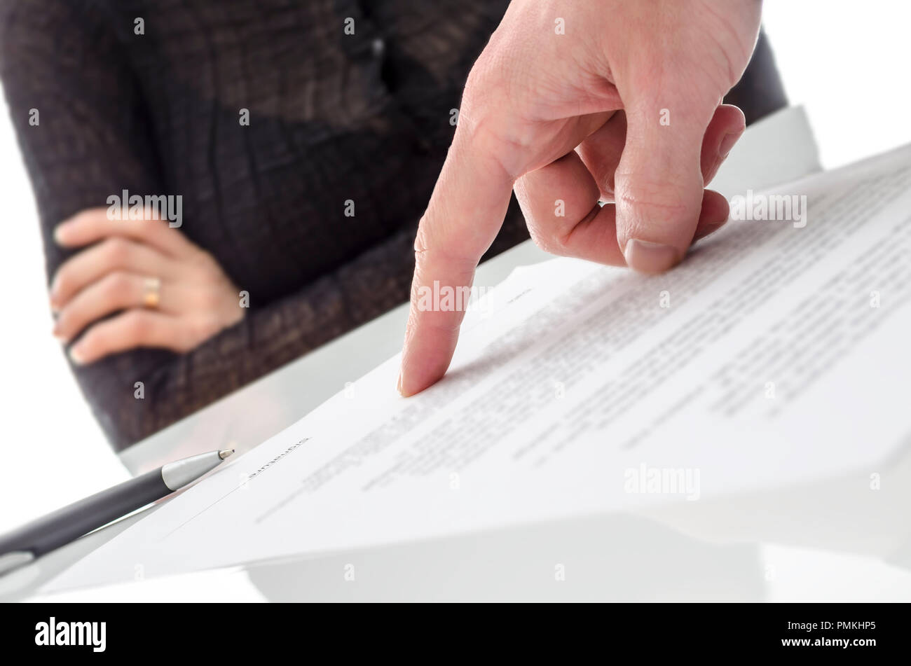 Male hand showing a woman where to sign a paper Stock Photo - Alamy