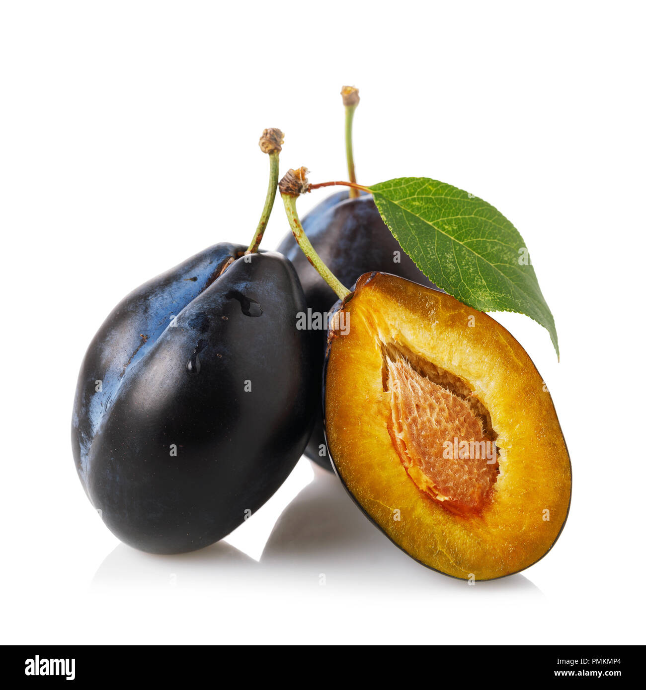 Three ripe fruit prunes isolated on white background Stock Photo - Alamy