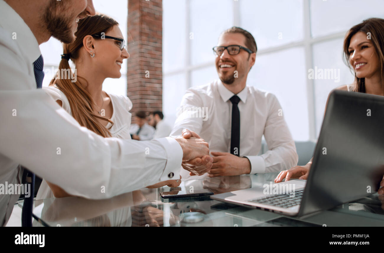business team sitting at the office table Stock Photo - Alamy