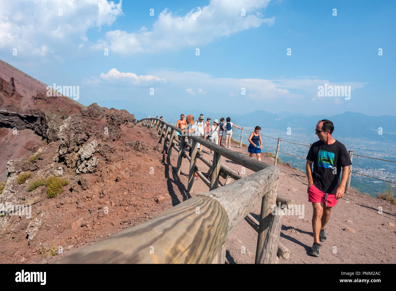 MOUNT VESUVIUS, ITALY - AUGUST 1, 2018: Tourists walk around the crater ...